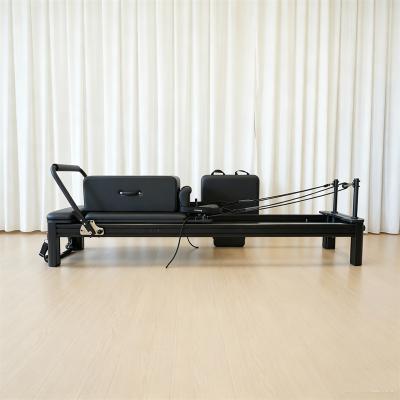 China Wholesale Matte Black Aluminum Full Track Pilates Reformer Core Bed Custom Logo Gym Training Gear for sale