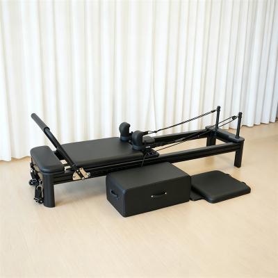China OEM Black Aluminium Alloy Pilates Reformer Full Track Design With Auxiliary Cushion Accessories for sale