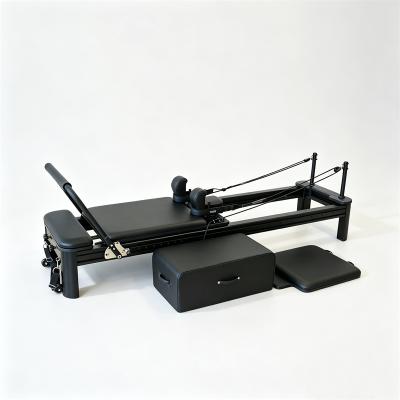 China Black Matte Aluminum Full Track Pilates Reformer with Full Accessories Professional Studio Core Bed for sale