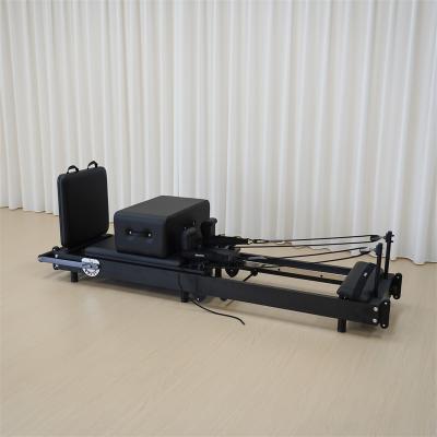 China Compact Foldable Wooden Pilates Reformer Adjustable Spring Core Training Bed for Gym Studio for sale