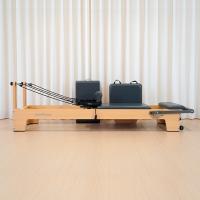 China Wood Reformer Pilates Machine Ideal For Fitness Centers And Home Gyms Offering Performance And Elegant Wooden Construction for sale
