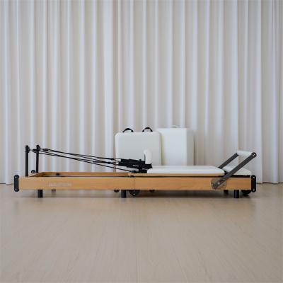China Commercial Foldable Wooden Pilates Reformer Equipment Multi Function Pilates Core Bed with Box Jump Board Bulk Order for sale