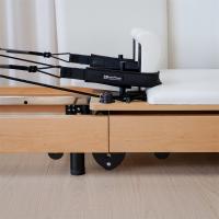 China Space Saving Foldable Wooden Pilates Reformer Portable Home Pilates Bed Small Apartment Yoga Training Machine for sale