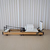 China Foldable Wooden Pilates Reformer Easy Move Home Pilates Machine With Wheels For Small Space Training for sale