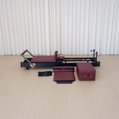 China OEM ODM Foldable Wooden Pilates Reformer Custom Logo Leather Color Solid Wood Pilates Core Bed Manufacturer for sale