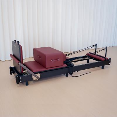China A Grade Beech Wood Foldable Pilates Reformer Luxury Wooden Pilates Bed Customized Color For High End Studio for sale