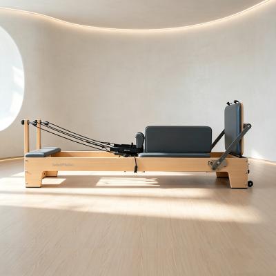 China OEM ODM Multi-Layer Wood Pilates Core Reformer Machine, Custom Leather Cushion Color, Home & Studio Pilates Training Bed for sale