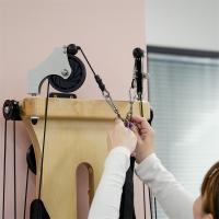 China Solid Wood Pulley Tower Designed for Pilates Exercises with Multi grip Straps to Support Posture Correction and Strength Training for sale