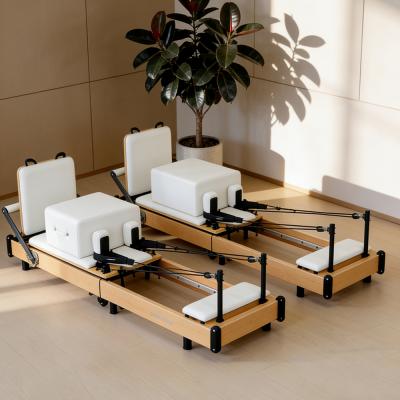 China Maple Wood Foldable Pilates Reformer Machine for Gym Studio Training With Box Smooth Carriage and Adjustable Footbar for sale