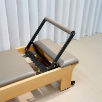 China Premium Beech Wood Pilates Reformer with Built-in Footbar and Adjustable Spring Resistance for Commercial Use for sale
