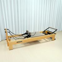 China Professional Beech Wood Pilates Reformer with Adjustable Spring System and Built-in Footbar for sale
