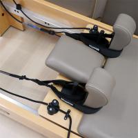 China Professional Beech Wood Pilates Reformer with Integrated Footbar and Adjustable Spring Resistance for sale