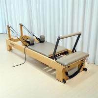 China Premium Beech Wood Pilates Reformer with Built-in Footbar and Adjustable Spring Resistance for Commercial Use for sale