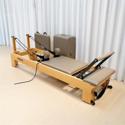 China Integrated Footbar, Complete Pilates Accessories, Adjustable Resistance Springs for Studio Beech Wood Pilates Reformer Machine Beech Wood Pilates Reformer with Integrated Footbar Full Accessories for sale