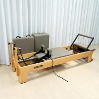 China Professional Beech Wood Pilates Reformer with Integrated Footbar and Adjustable Spring Resistance for sale