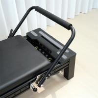 China User friendly Pilates Reformer machine featuring adjustable springs padded platform and sturdy frame for performance for sale