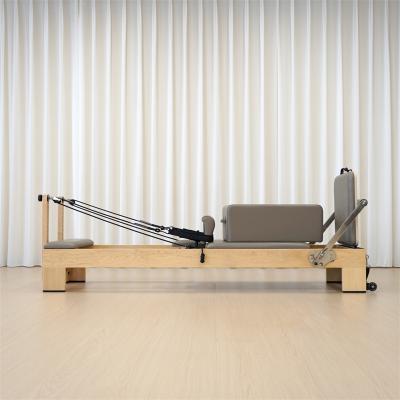 China Professional Maple Wood Pilates Reformer Machine with 5 Adjustable Springs and Compact Size 2250*630*300mm for sale