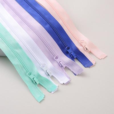 China Durable Flexible 3# Nylon Coil Separating Zipper Color Matching For Garments for sale