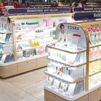 China Free standing wood cosmetic display stand cosmetic product store shelf nail polish display cabinets for sale