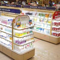 China Free standing wood cosmetic display stand cosmetic product store shelf nail polish display cabinets for sale
