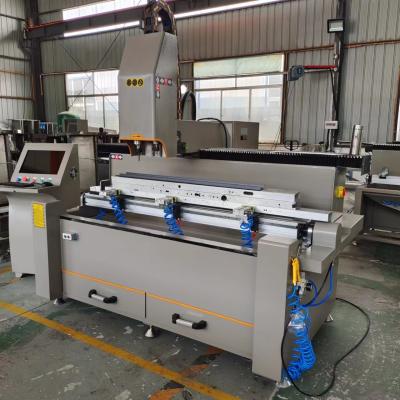 China 1500mm Double Head CNC Drilling and Milling Machine 3 Axis Aluminum Profile Window Door Making for sale