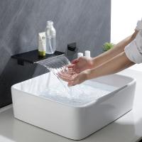 China 35MM Valve Seat Diameter Hot and Cold Waterfall Spout Bathroom Sink Tap for Wall Basin for sale