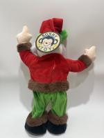 China Waving and Singing Santa Plush Toy Green Pants Musical Doll Electric Animated for sale