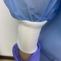 China Medical Disposable PP Non-woven Lab Coat with Cuffs for sale