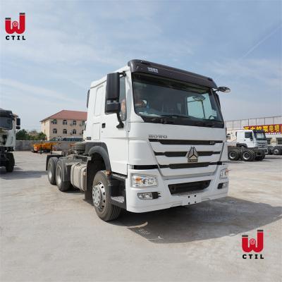 China SINOTRUK HOWO New Red Heavy Duty 6x4 Tractor Trailer Head Truck for sale