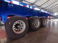 China 3 Axles Flat Truck Semi Trailers 80 Tons Flatbed Trailer Container for sale