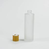 China 100ml Frosted Glass Collar Skin Care Serum Toner Lotion Bottle with Bamboo Disk Cap for sale