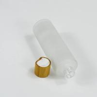 China 100ml Frosted Glass Collar Skin Care Serum Toner Lotion Bottle with Bamboo Disk Cap for sale