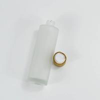 China 100ml Frosted Glass Collar Skin Care Serum Toner Lotion Bottle with Bamboo Disk Cap for sale