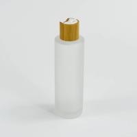 China 100ml Frosted Glass Collar Skin Care Serum Toner Lotion Bottle with Bamboo Disk Cap for sale