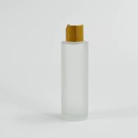 China 100ml Frosted Glass Collar Skin Care Serum Toner Lotion Bottle with Bamboo Disk Cap for sale