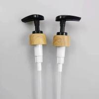 China Non-Refillable Shampoo Bottle Lotion Pump 24/410 28/410 with Bamboo Printing Lid for sale