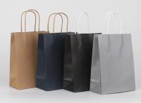 China Custom Logo Paper Kraft Shopping Bag Embossing With Handle for sale