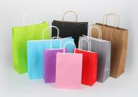 China Custom Logo Paper Kraft Shopping Bag Embossing With Handle for sale