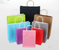 China Custom Logo Paper Kraft Shopping Bag Embossing With Handle for sale