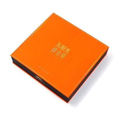 China Custom Printing Gold Foil Orange Black Beauty Makeup Folding Magnetic Gift Box With Tray for sale