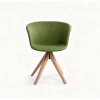 China Swivel Restaurant Armchair Fabric-upholstered PP Shell Tapered Beech Wood Legs for sale
