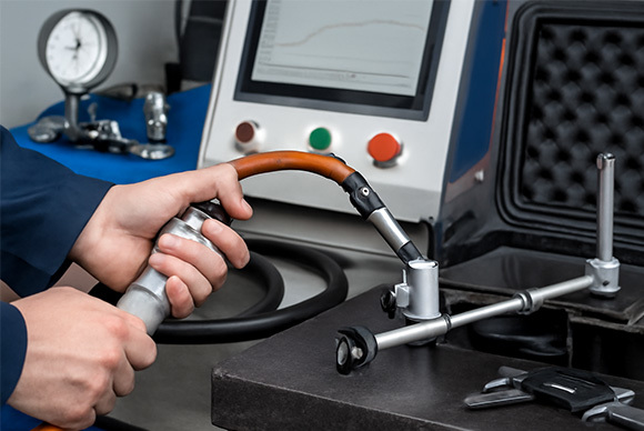 CB-10218 high-flow hydraulic coupler in precision testing setup