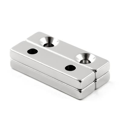 China Super Strong Double Hole Neodymium Block Magnets for Engineering Temperature Resistance for sale
