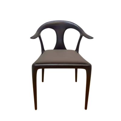China Sculptural Ash Wood Dining Chair with Dynamic Lines and Tufted Leather Seat for Restaurants and Homes for sale