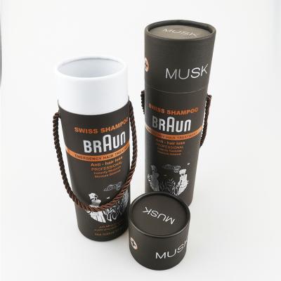 China Festive Round Kraft Paper Tube Gift Box Packaging With Carry Handle Custom Design for sale