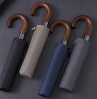 China 8 Ribs Fiberglass Automatic 3 Fold Umbrella With Wood Handle for sale