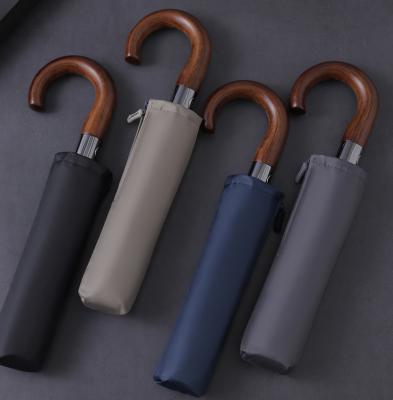 China 8 Ribs Fiberglass Automatic 3 Fold Umbrella With Wood Handle for sale