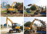 China 6000kg Wheeled Excavator / Mini Tire Excavators / Wood Grabber New Compact Excavators 55kw Engine Excavator Color Option for sale
