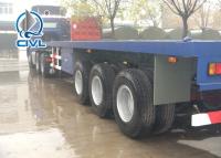 China 3 Axles New Loading Construction Machines Hydraulic Flatbed Semi Trailer 70 Tons 17m for sale
