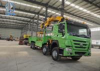 China 8x4 Howo Lorry Sidewall Cargo Truck Green Colour 14t Knuckle Boom Crane for sale